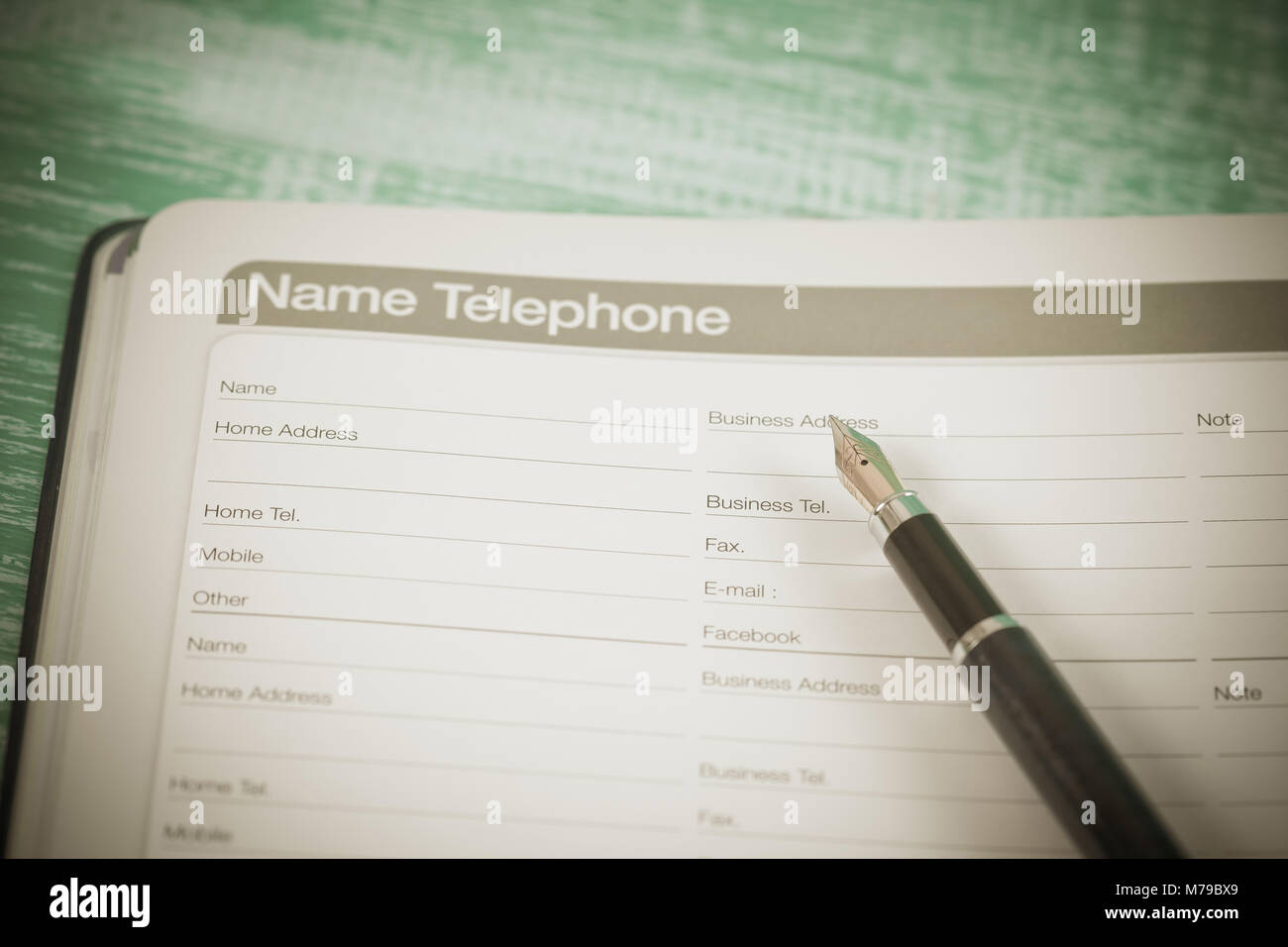 number telephone list on page of diary book planner with color tone ...