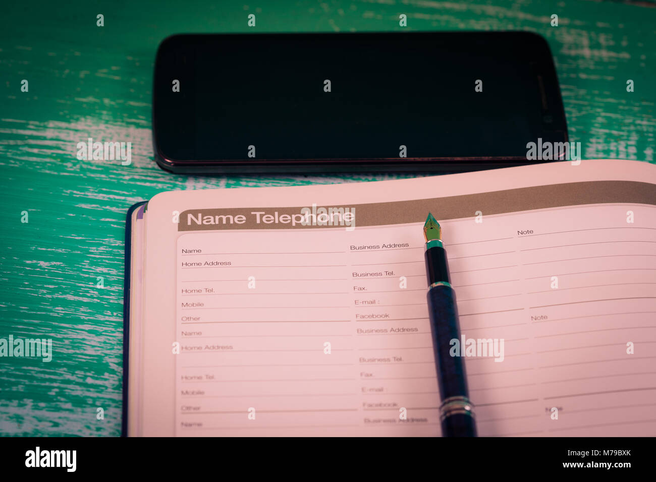 number telephone list on page of diary book planner with color tone ...