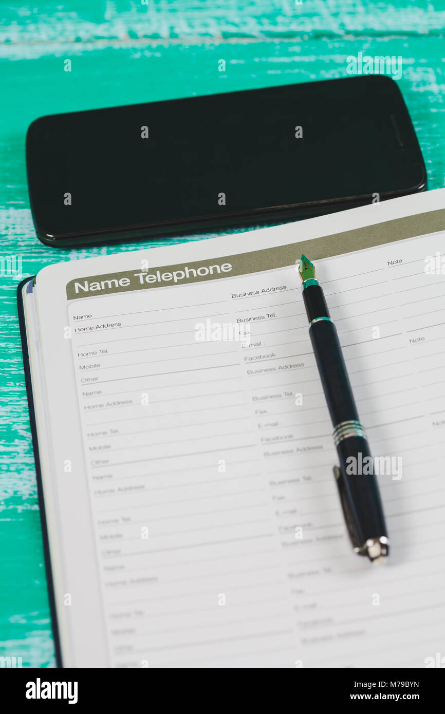 number telephone list on page of diary book planner with color tone ...