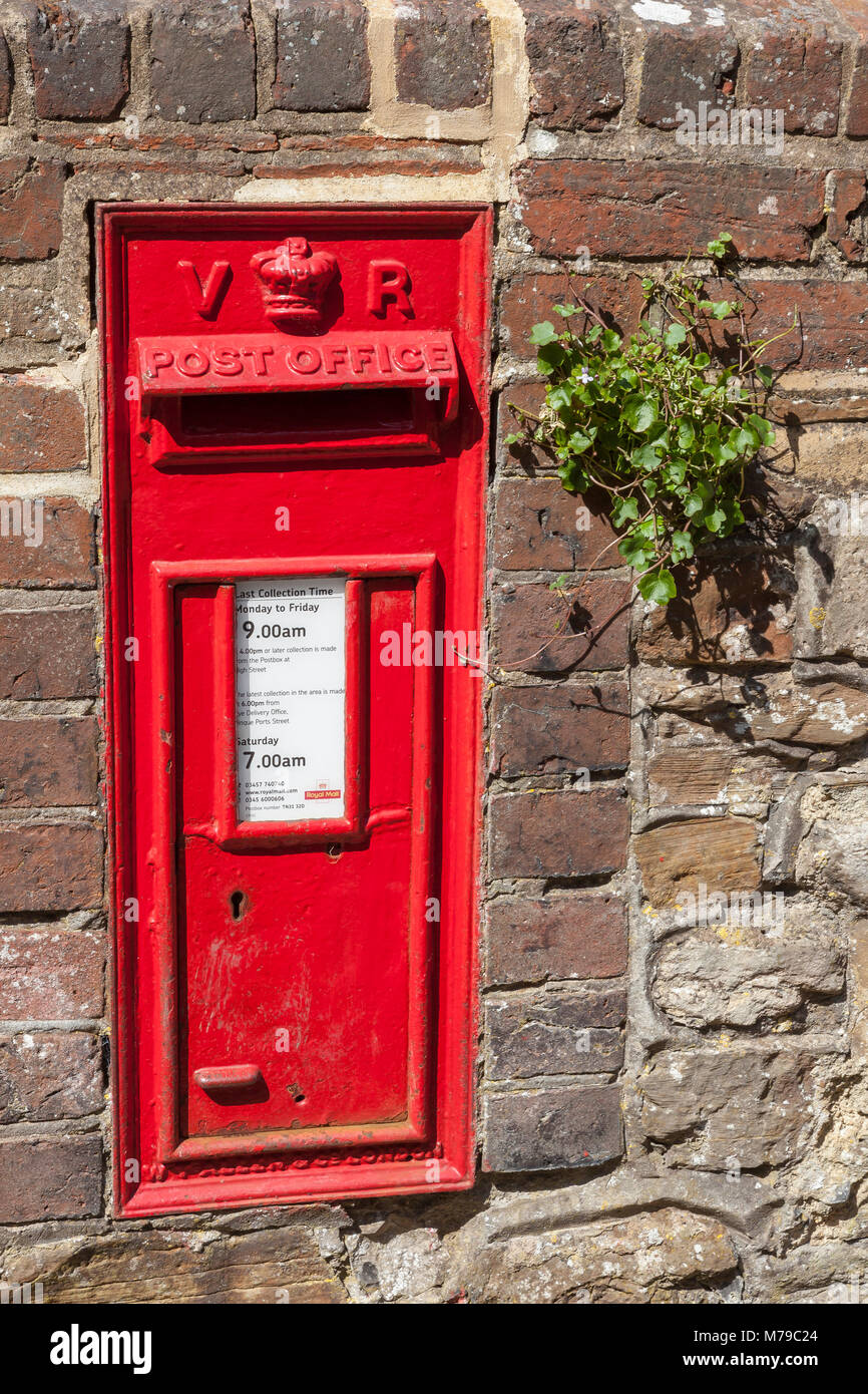 Queen Victoria post box set into a brick wall in Rye, East Sussex, UK ...