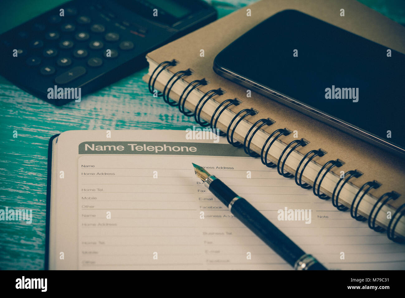 number telephone list on page of diary book planner with color tone ...