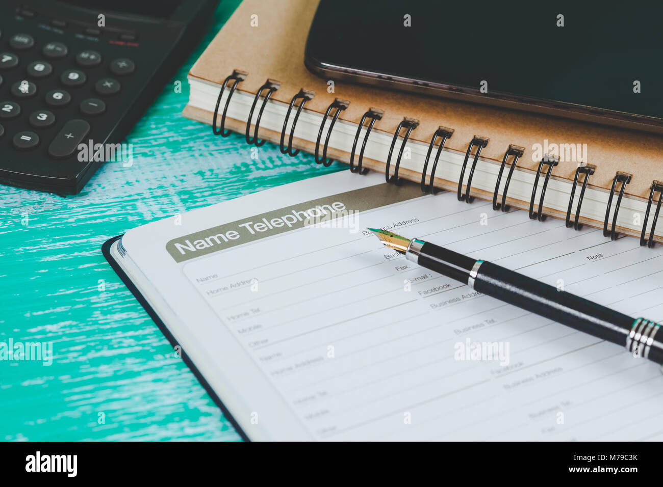 number telephone list on page of diary book planner with color tone ...