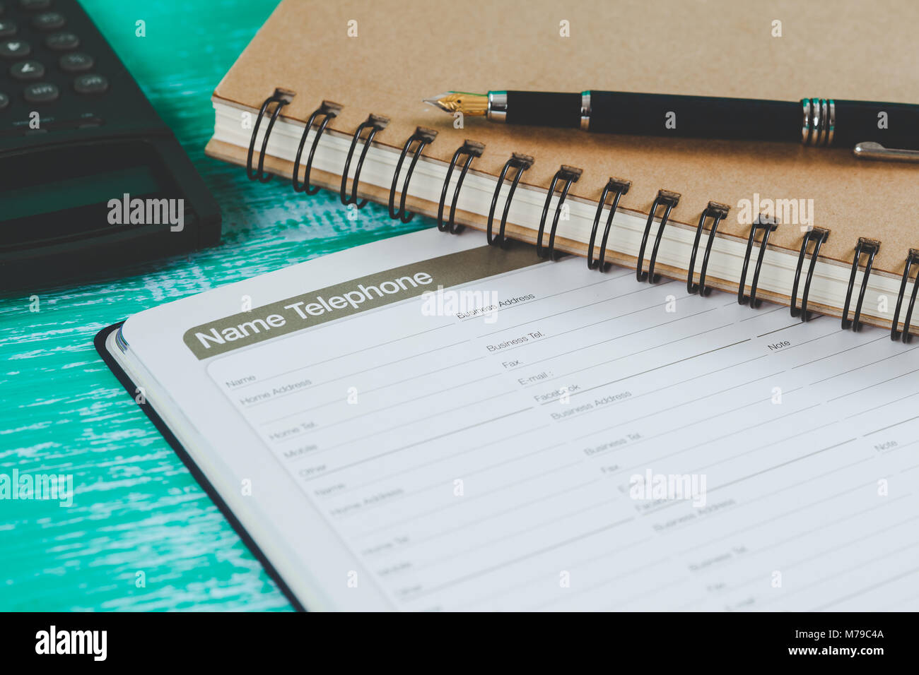 number telephone list on page of diary book planner with color tone ...