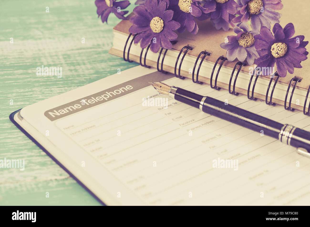 number telephone list on page of diary book planner with color tone ...