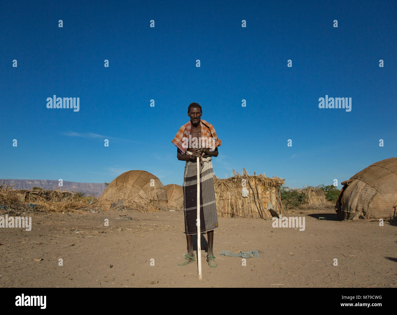 Afar tribe man in front of his village, Afar region, Afambo, Ethiopia ...