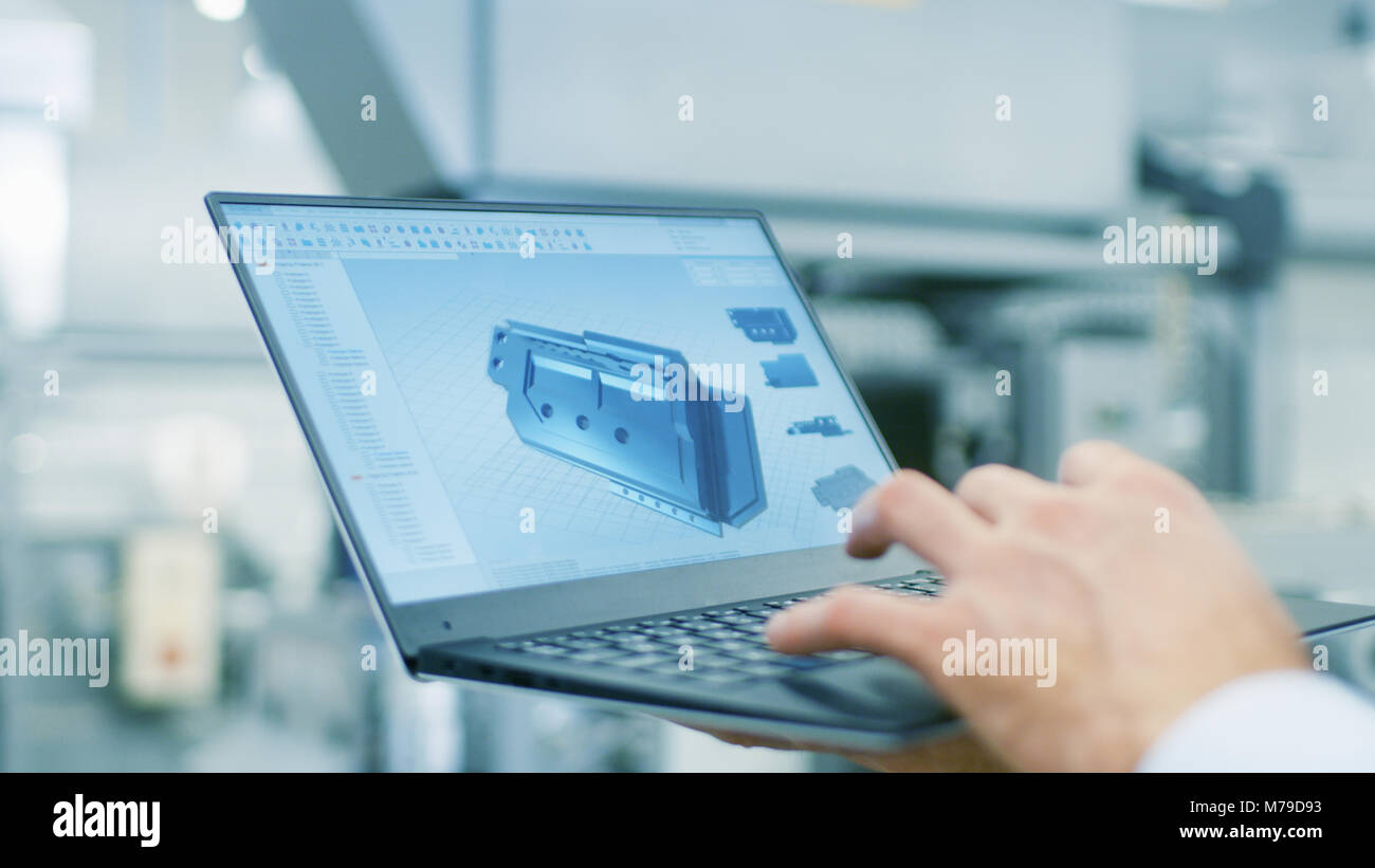 Close-up of the Engineer Holding Laptop with CAD Component Model on ...