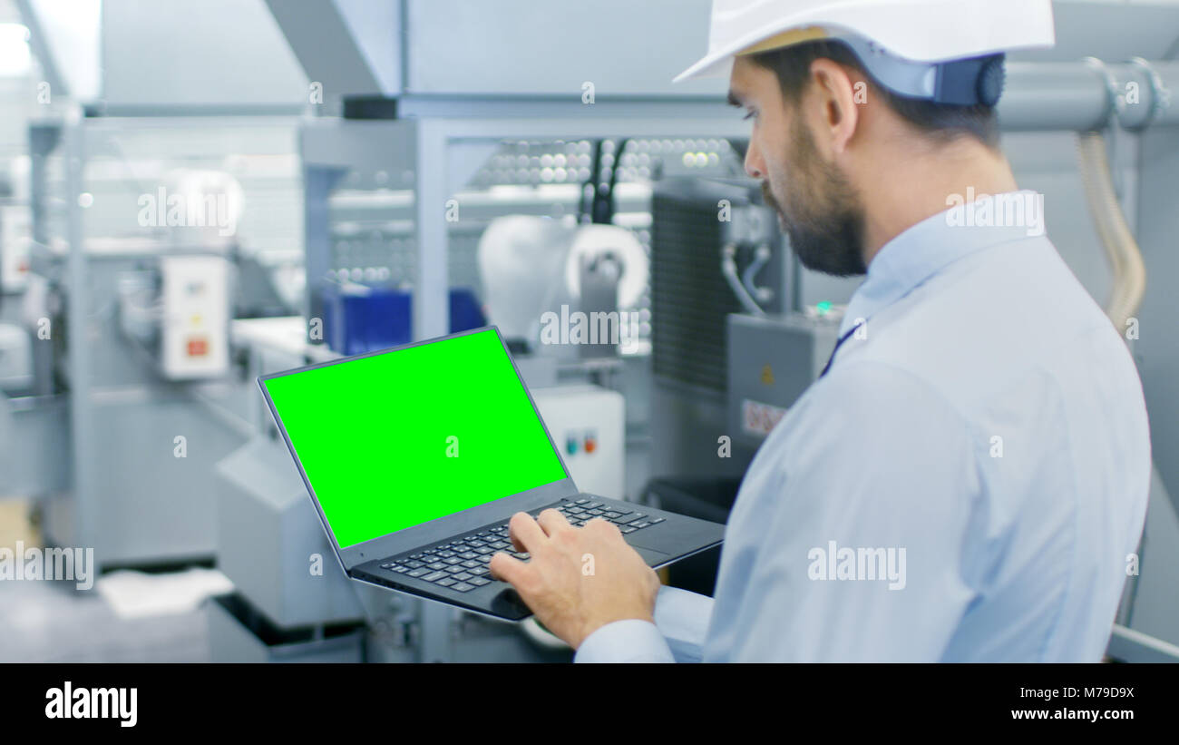 Close-up of the Engineer Holding Laptop with Green Screen Chroma Key ...