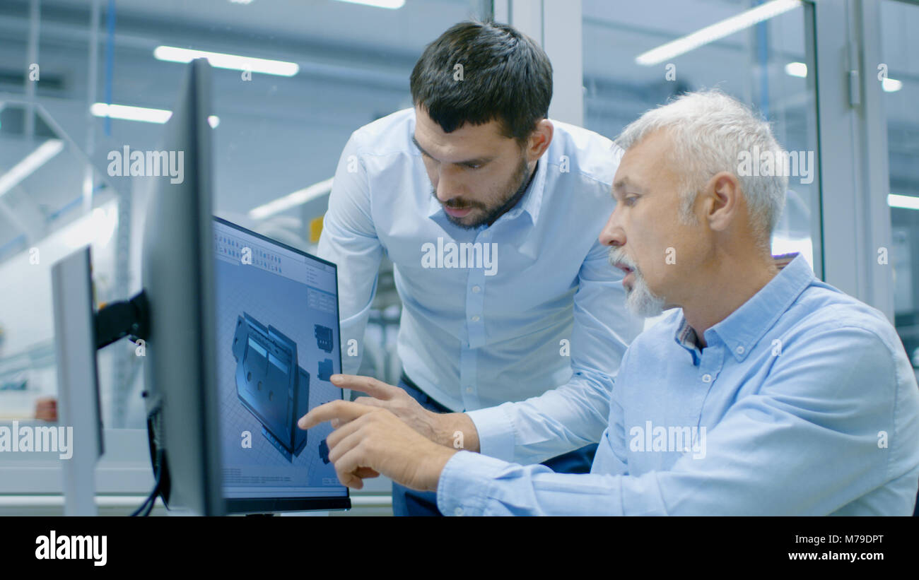 Industrial Designer Has Product Discussion with Senior Engineer While ...