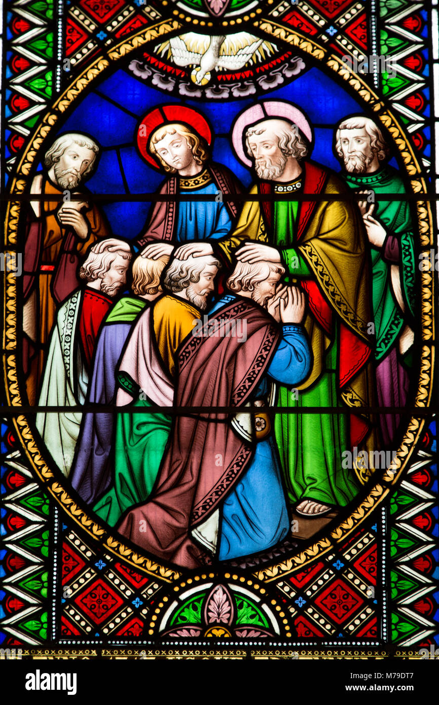 Depiction of a saint giving a blessing on a stained glass window ...