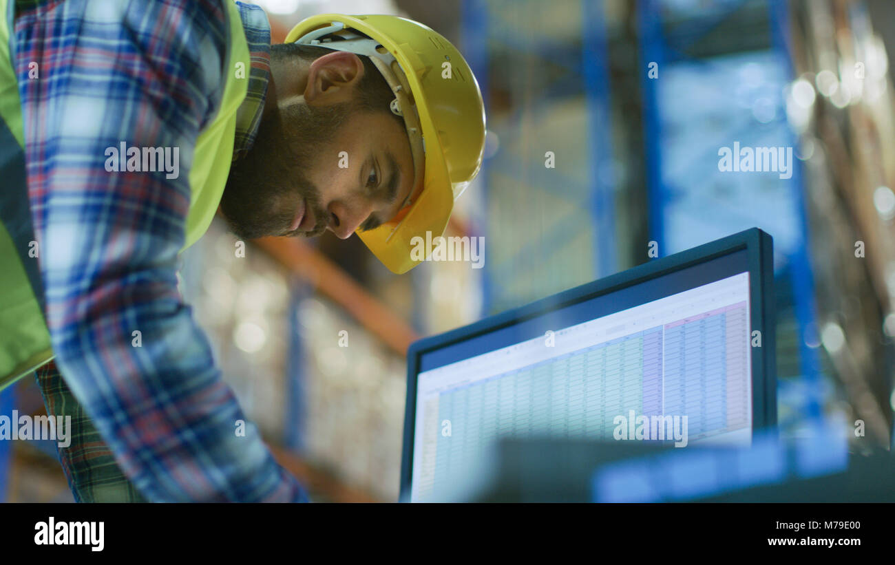 Male Inspector Wearing Hard Hat Fills in Spreadsheets on His Personal ...