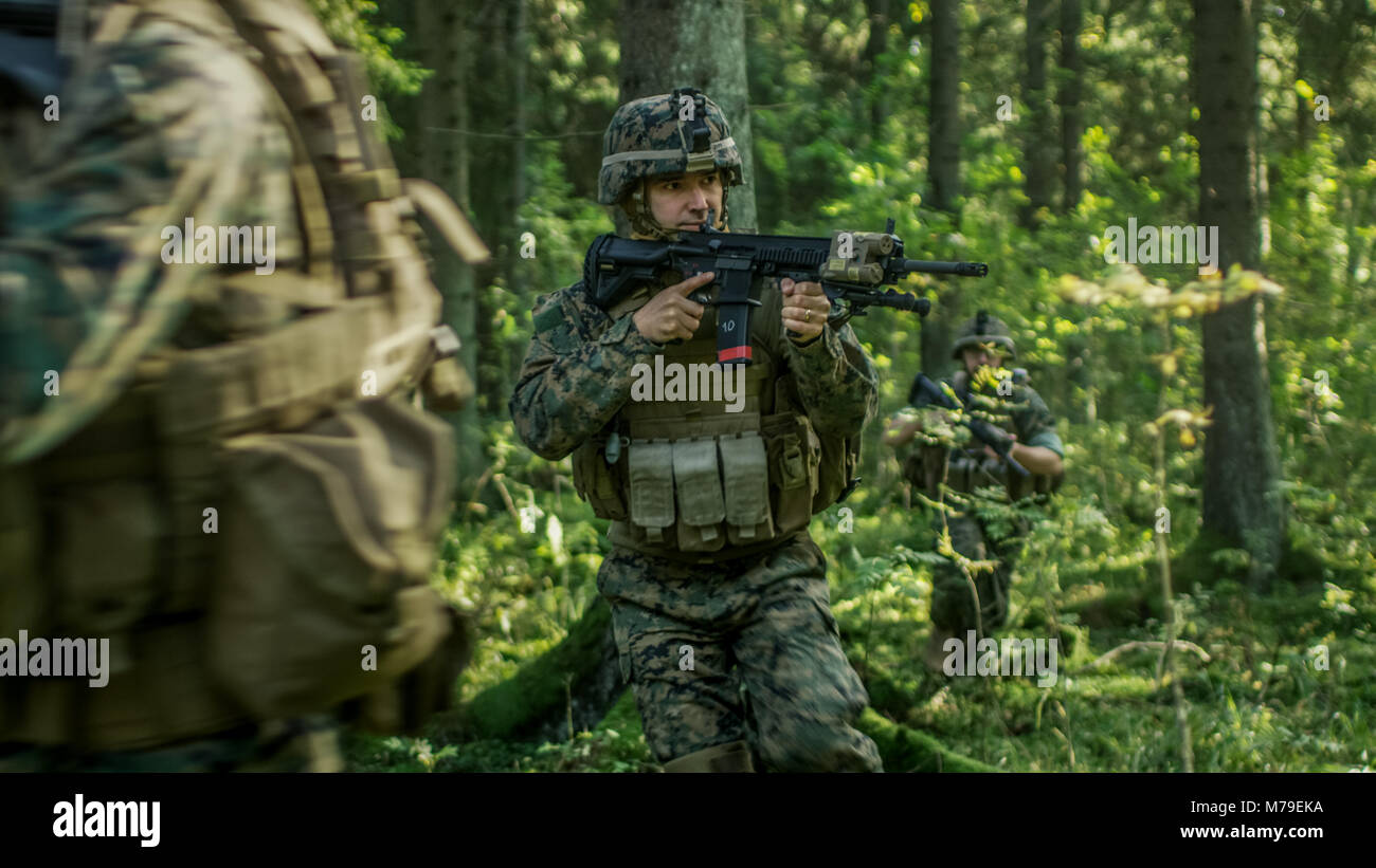 Squad of Five Fully Equipped Soldiers in Camouflage on a Reconnaissance ...