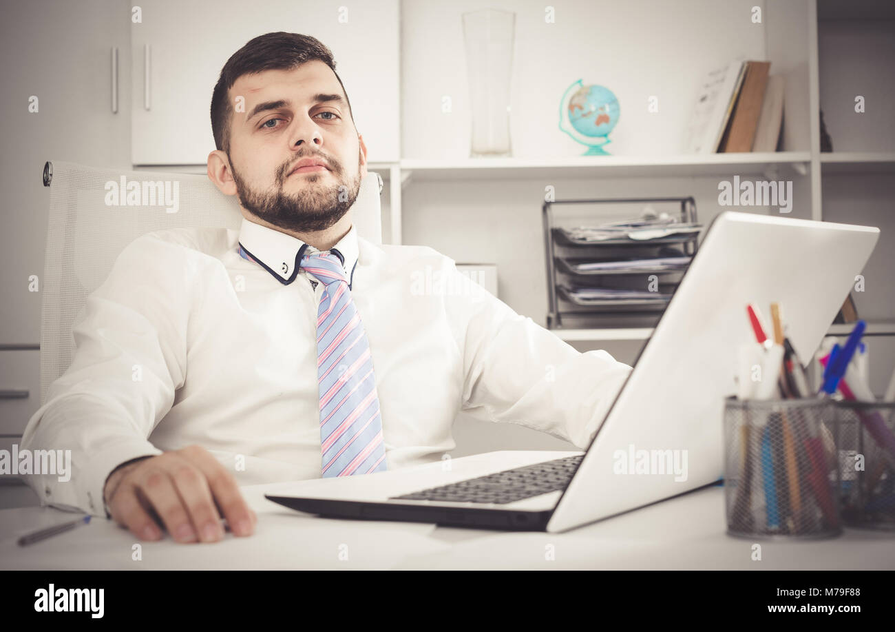 Smiling man worker working effectively on project in office Stock Photo ...
