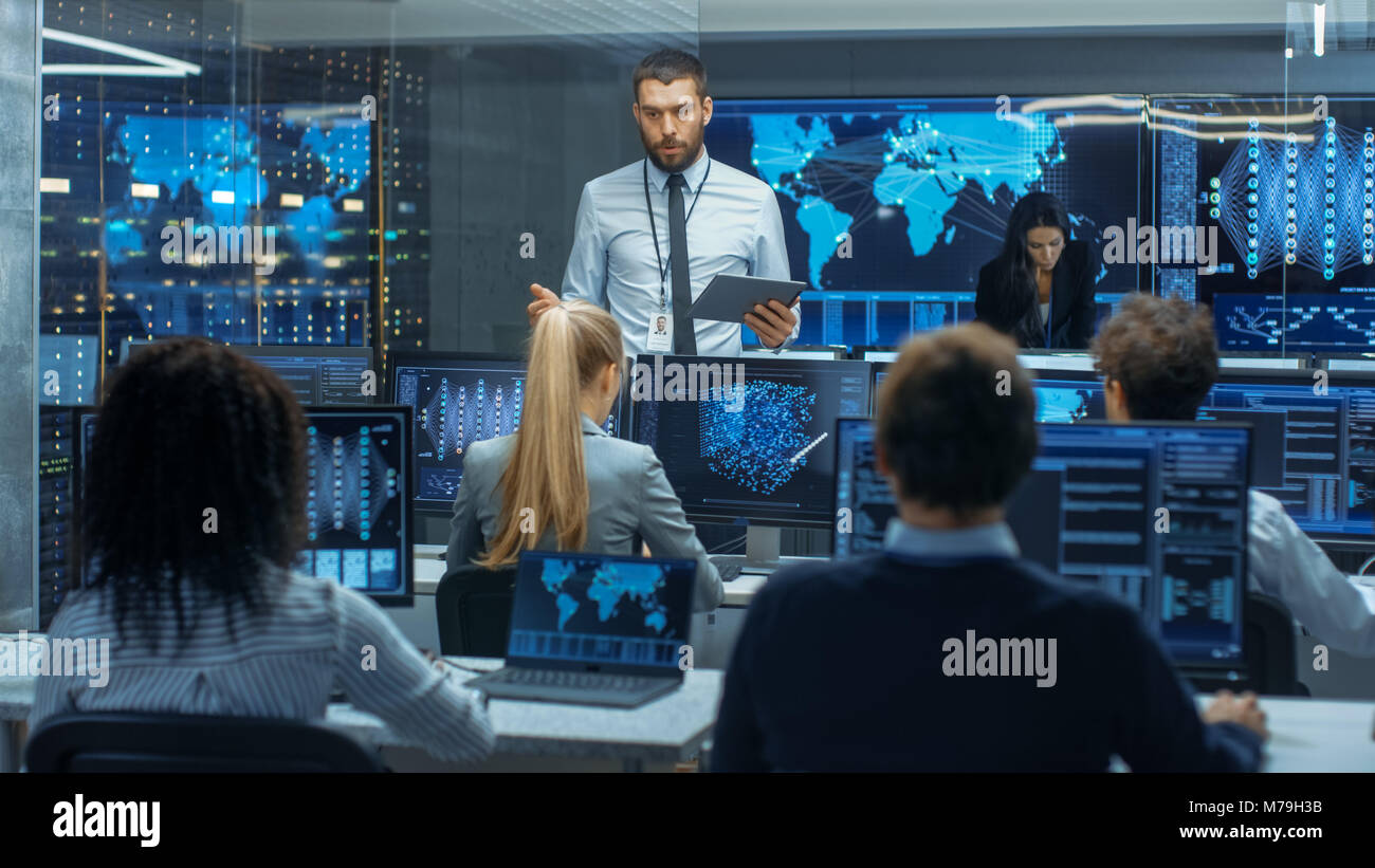 Chief Project Engineer Holds Briefing for a Team of Scientists that are ...