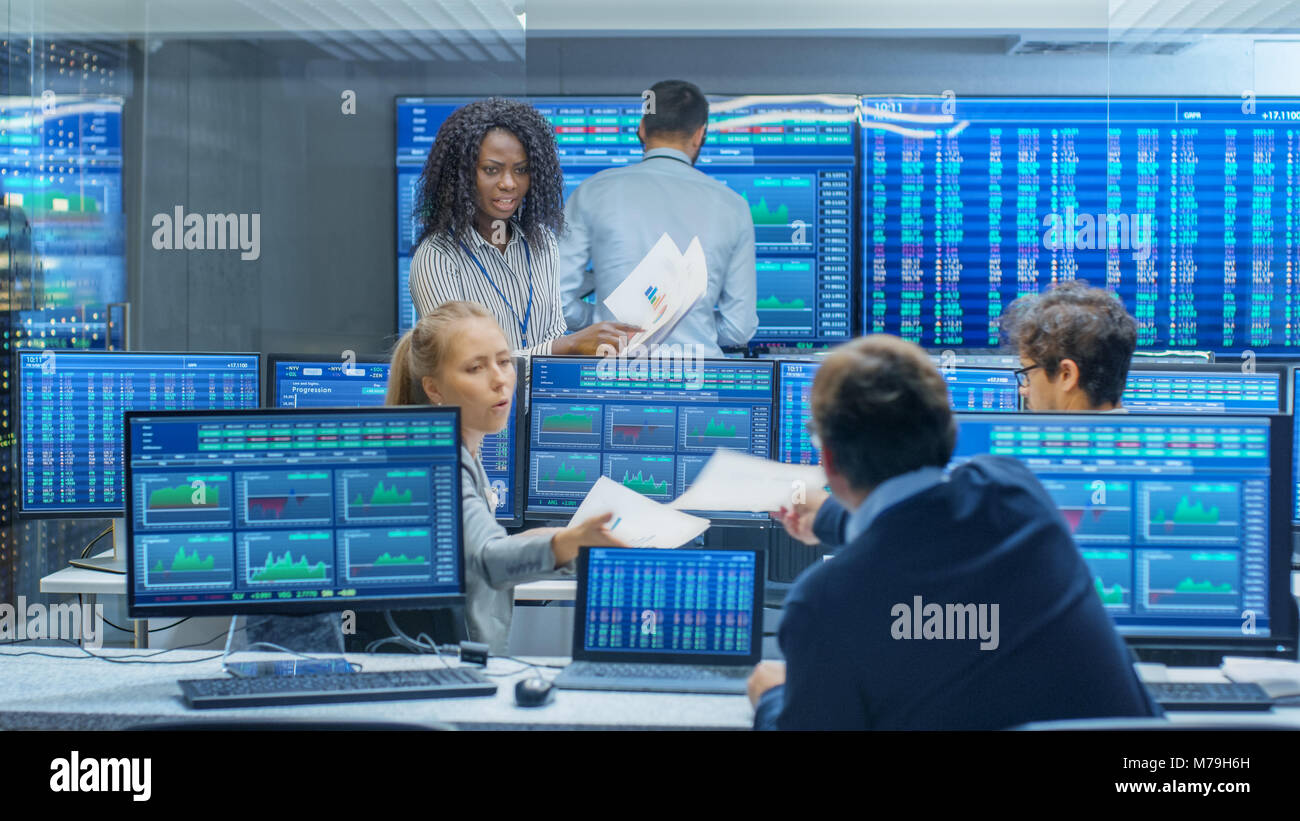 Black male trader monitoring stock hi-res stock photography and images ...