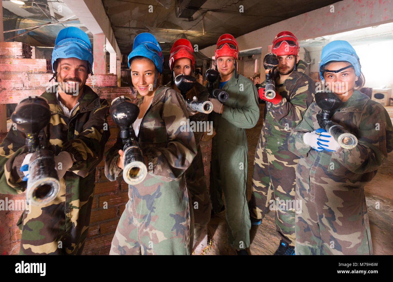 Portrait of friends who are ready for paintball playing Stock Photo - Alamy