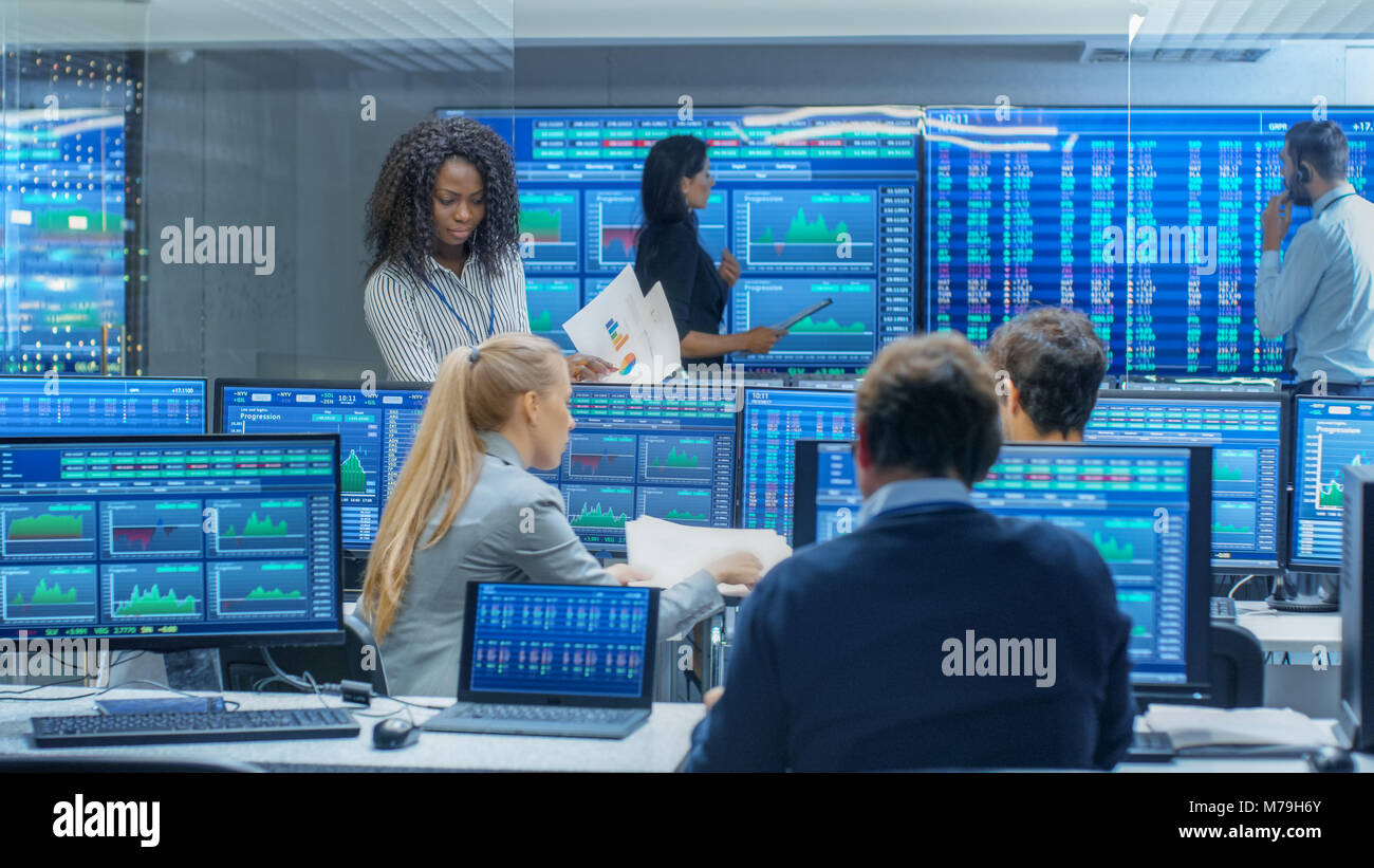 Multi-Ethnic Team of Traders is Busy Working at the Stock Exchange ...