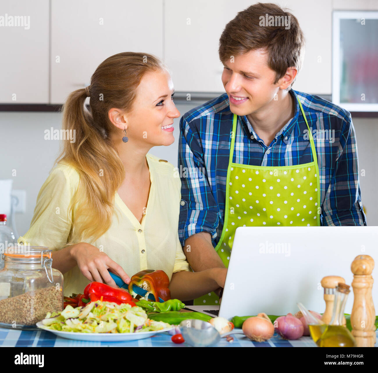 Family cooking recipe on laptop hi-res stock photography and images - Alamy