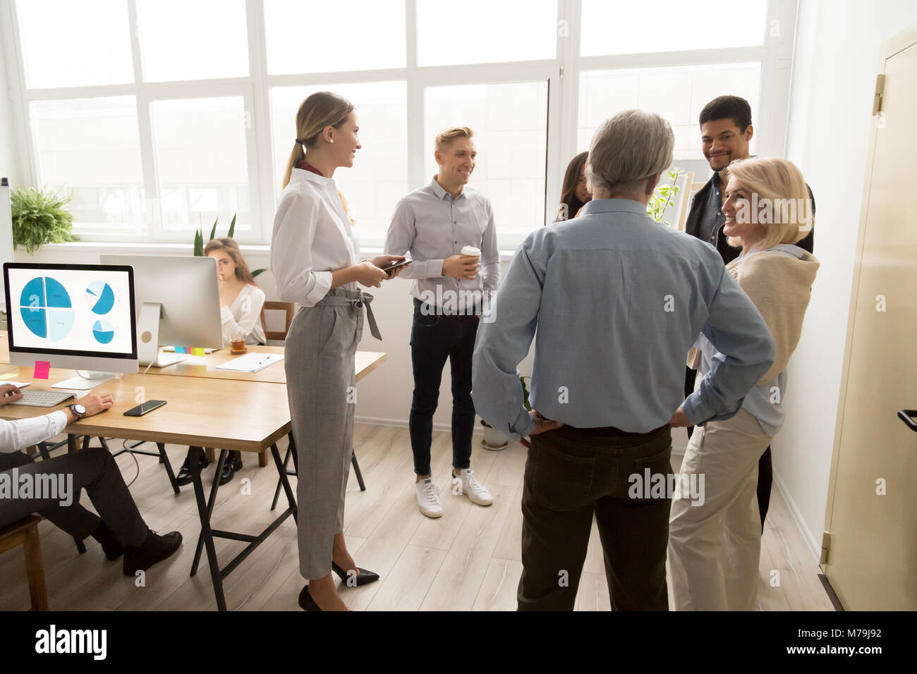 Office workers talking hi-res stock photography and images - Alamy