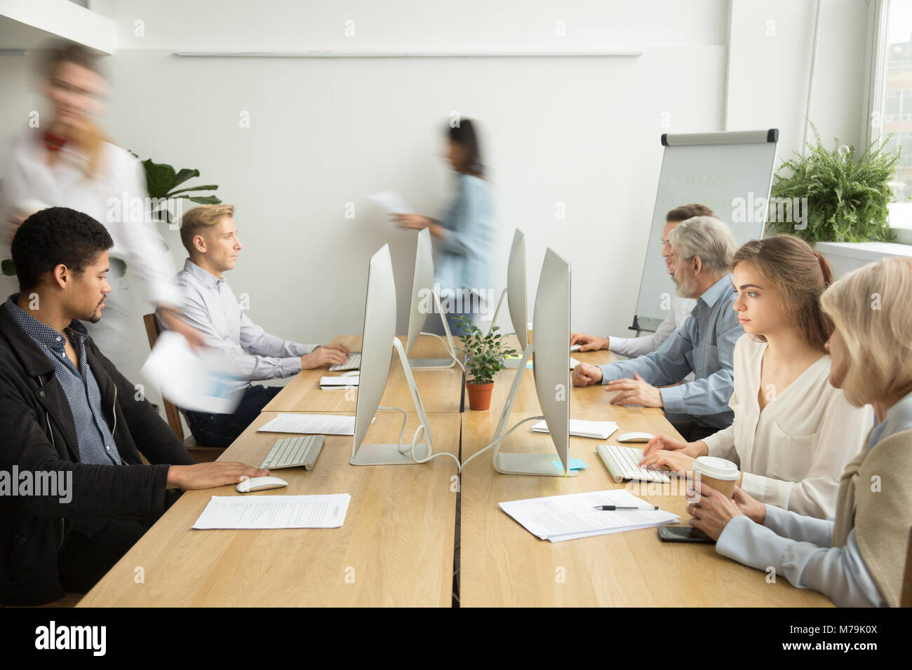 Busy modern coworking office with diverse people working on comp Stock ...