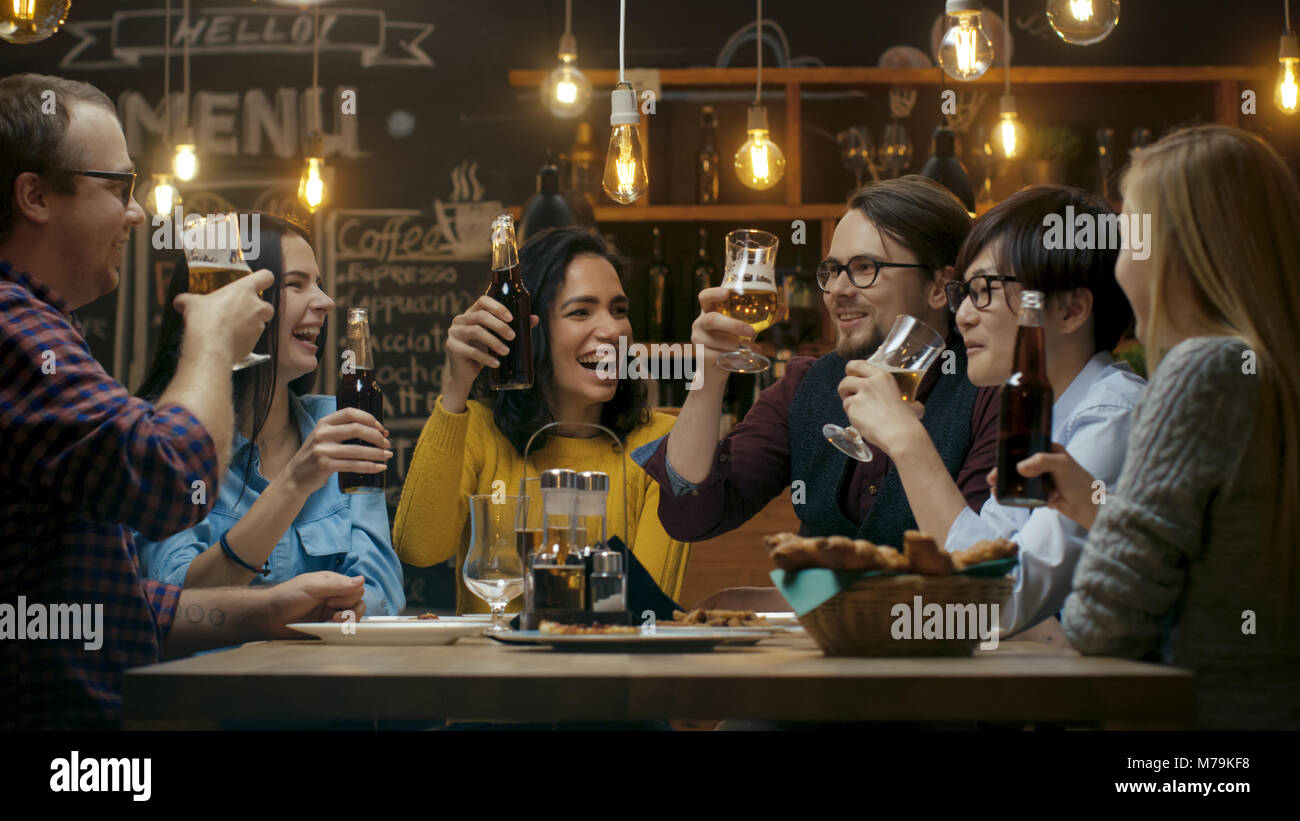 Diverse Group of Friends Celebrate with a Toast and Clink Raised ...