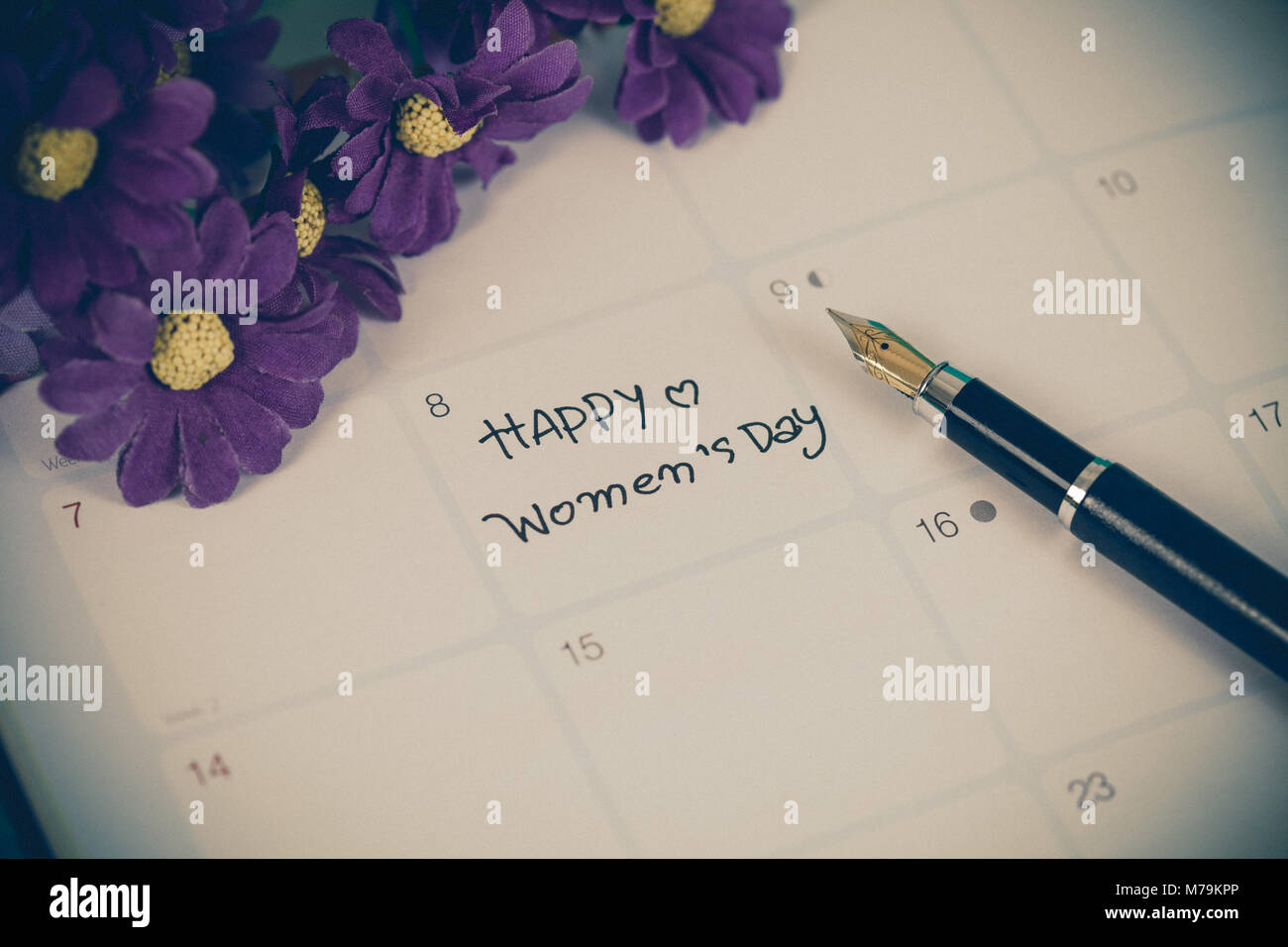 Happy women's day note on calendar book Stock Photo - Alamy