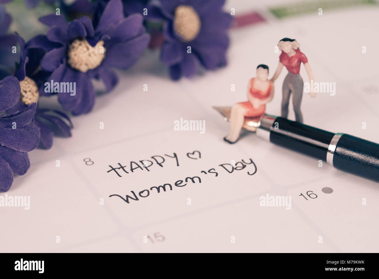 Happy women's day note on calendar book Stock Photo - Alamy