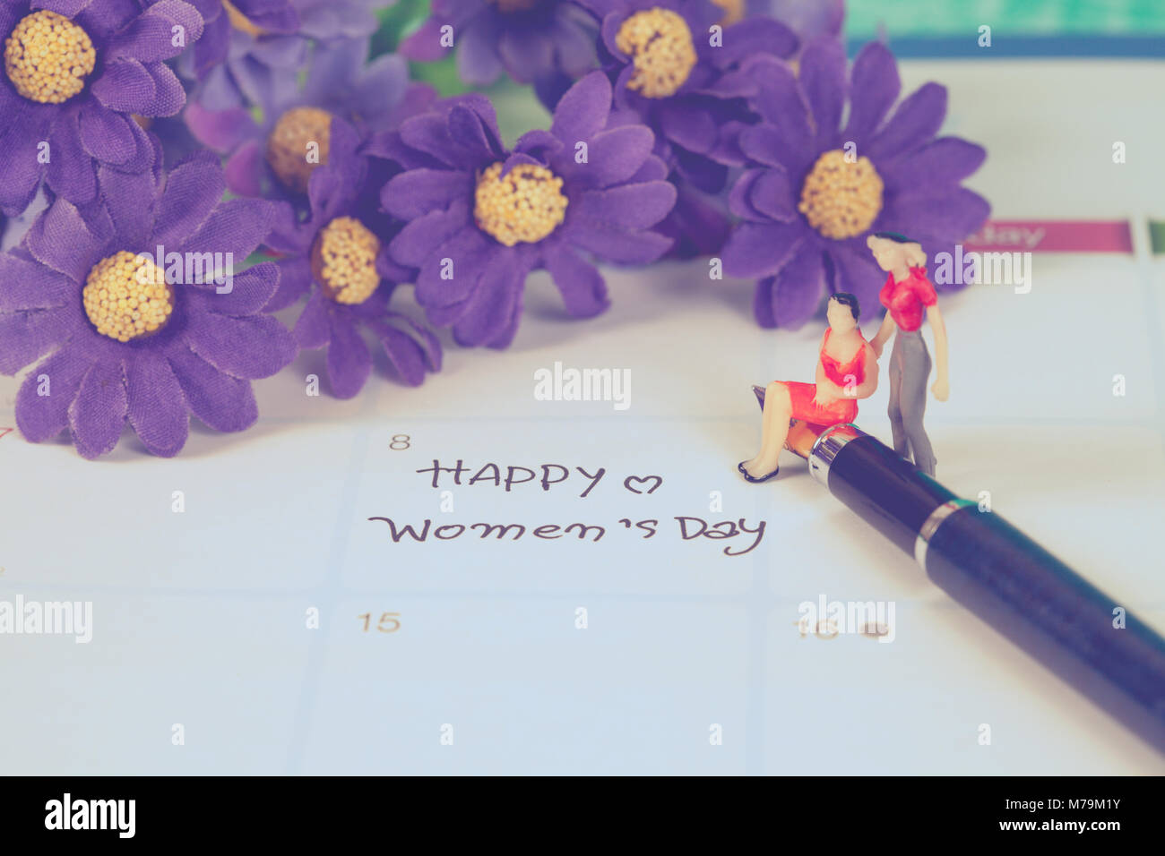 Happy women's day note on calendar book Stock Photo - Alamy