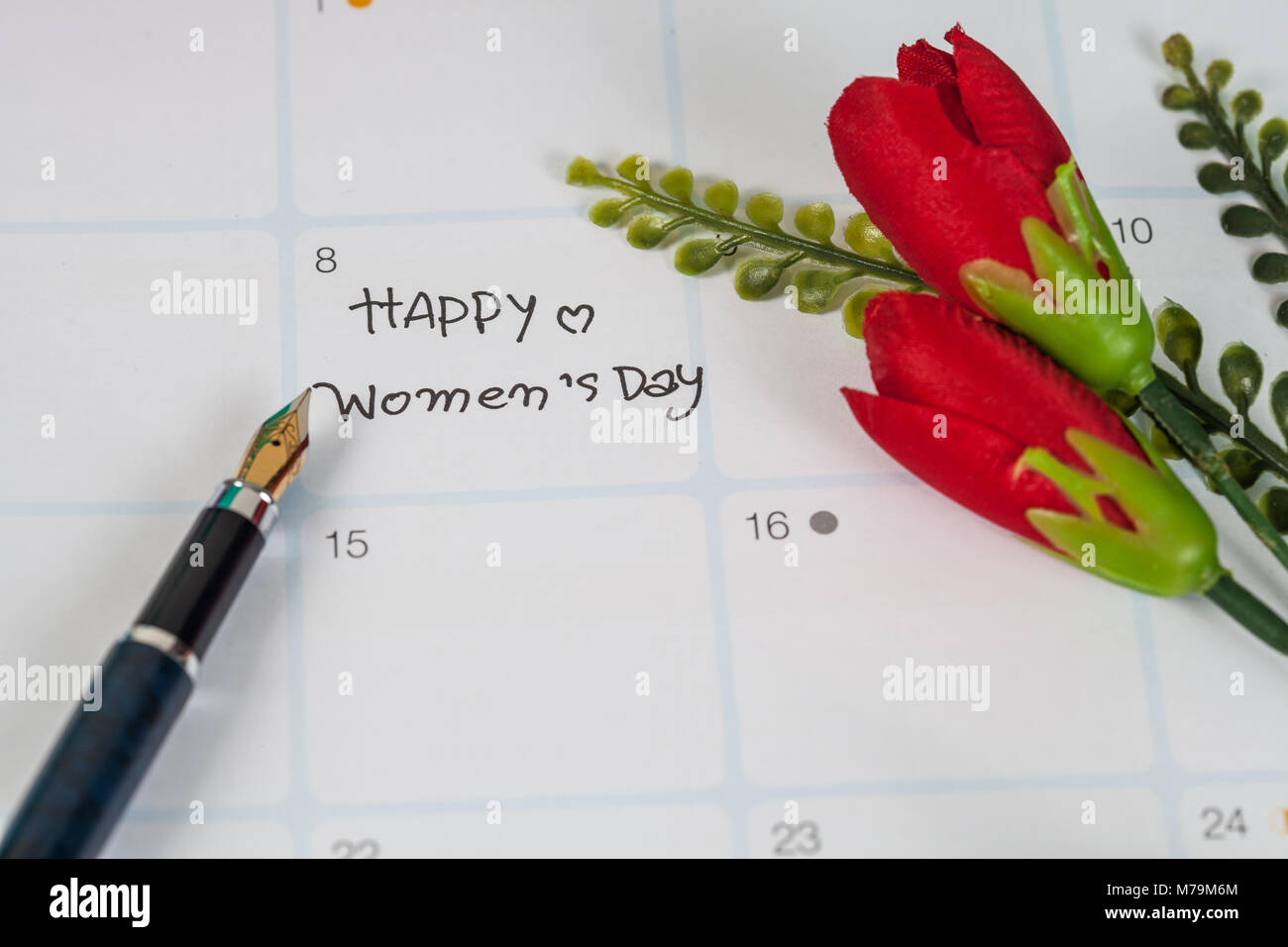 Happy women's day note on calendar book Stock Photo - Alamy