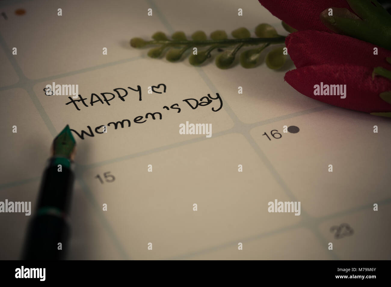 Happy women's day note on calendar book Stock Photo - Alamy