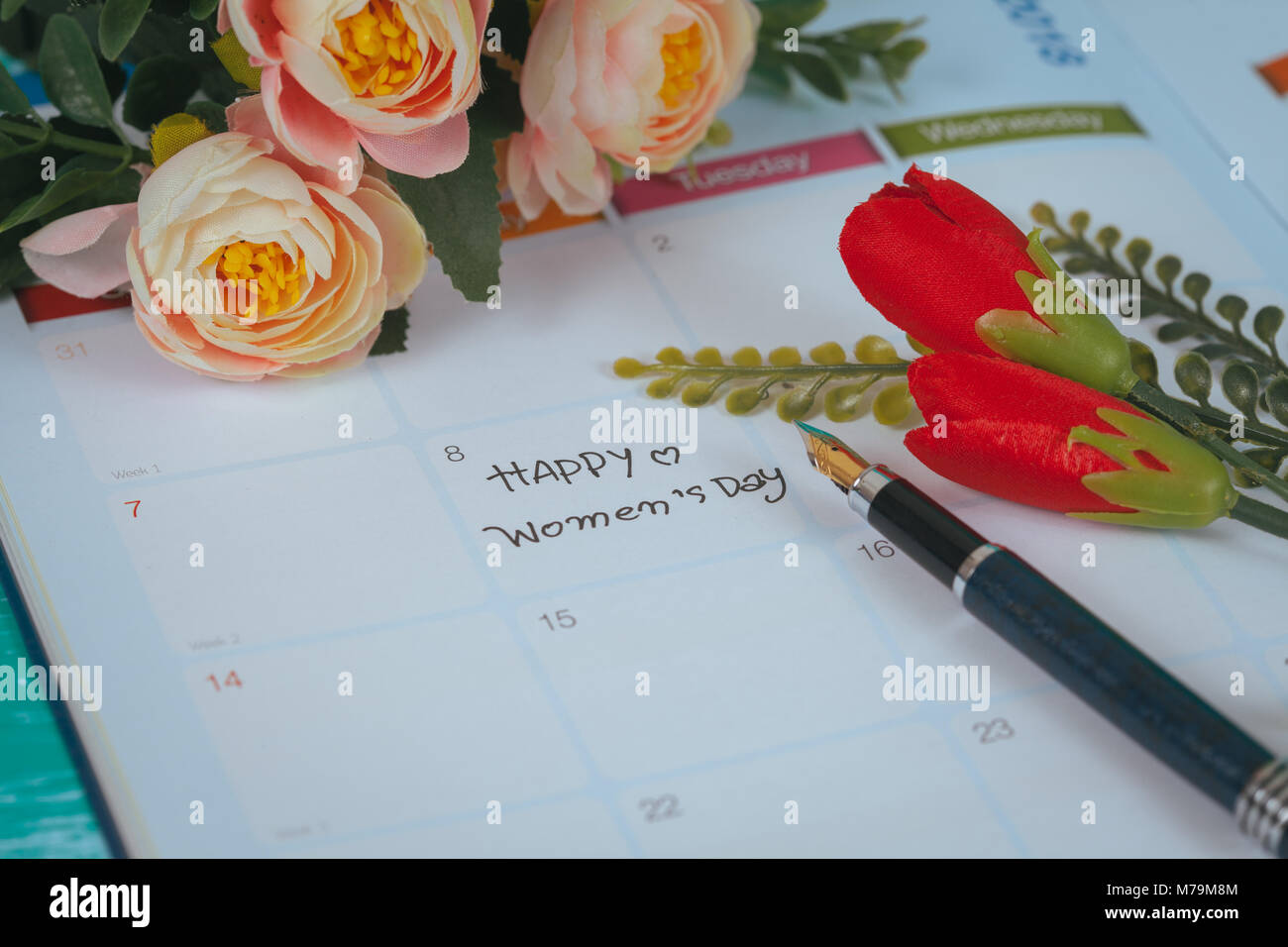 Happy women's day note on calendar book Stock Photo - Alamy