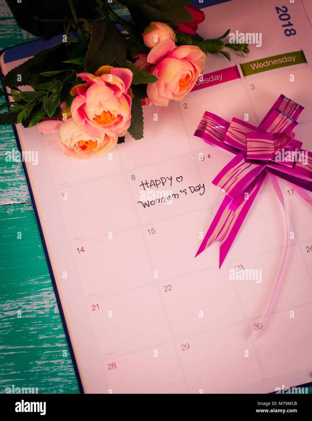 Happy women's day note on calendar book Stock Photo - Alamy