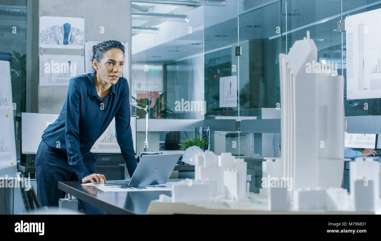 Female Architectural Designer Works on a Laptop, Engineering New ...