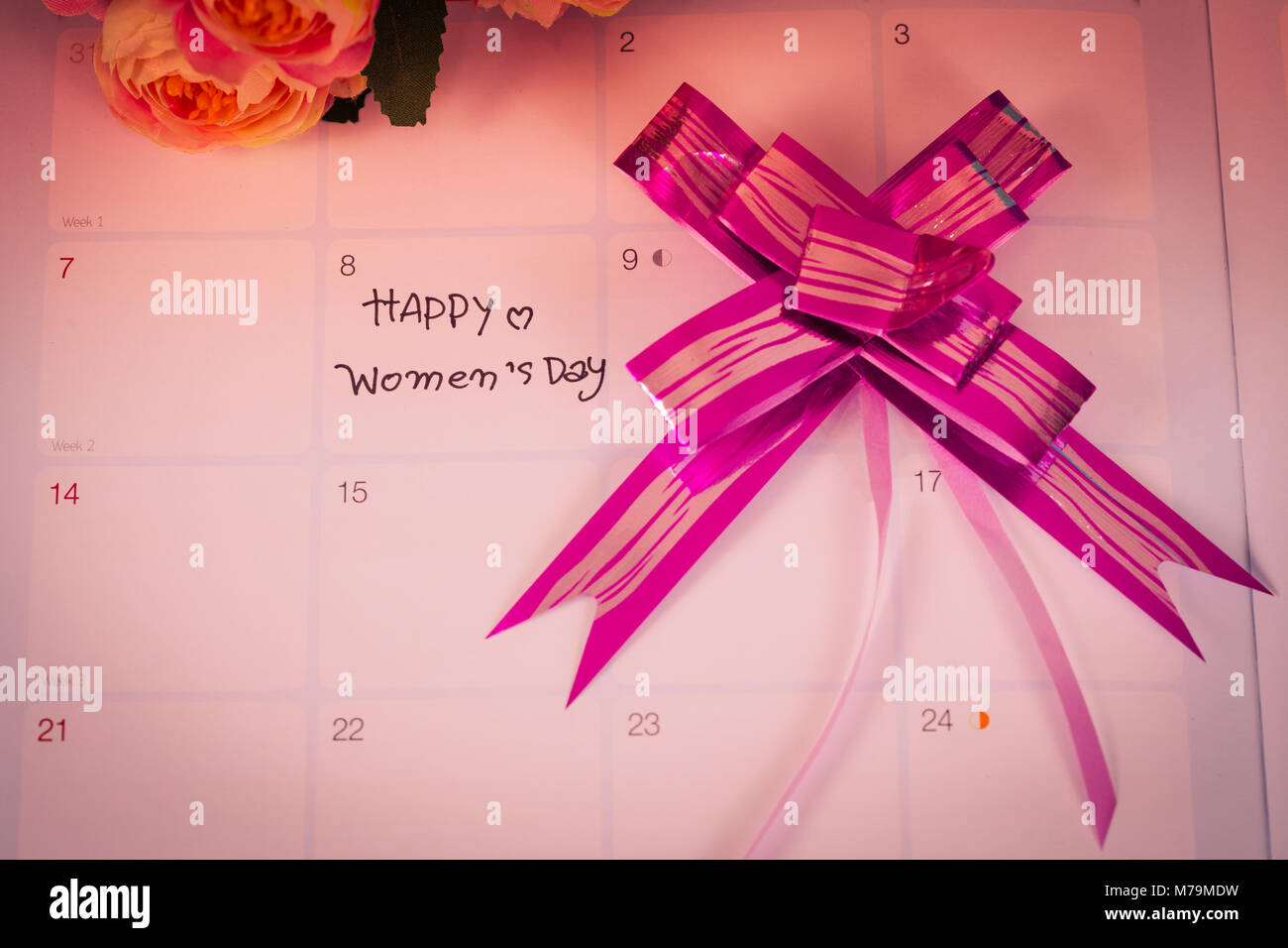 Happy women's day note on calendar book Stock Photo - Alamy
