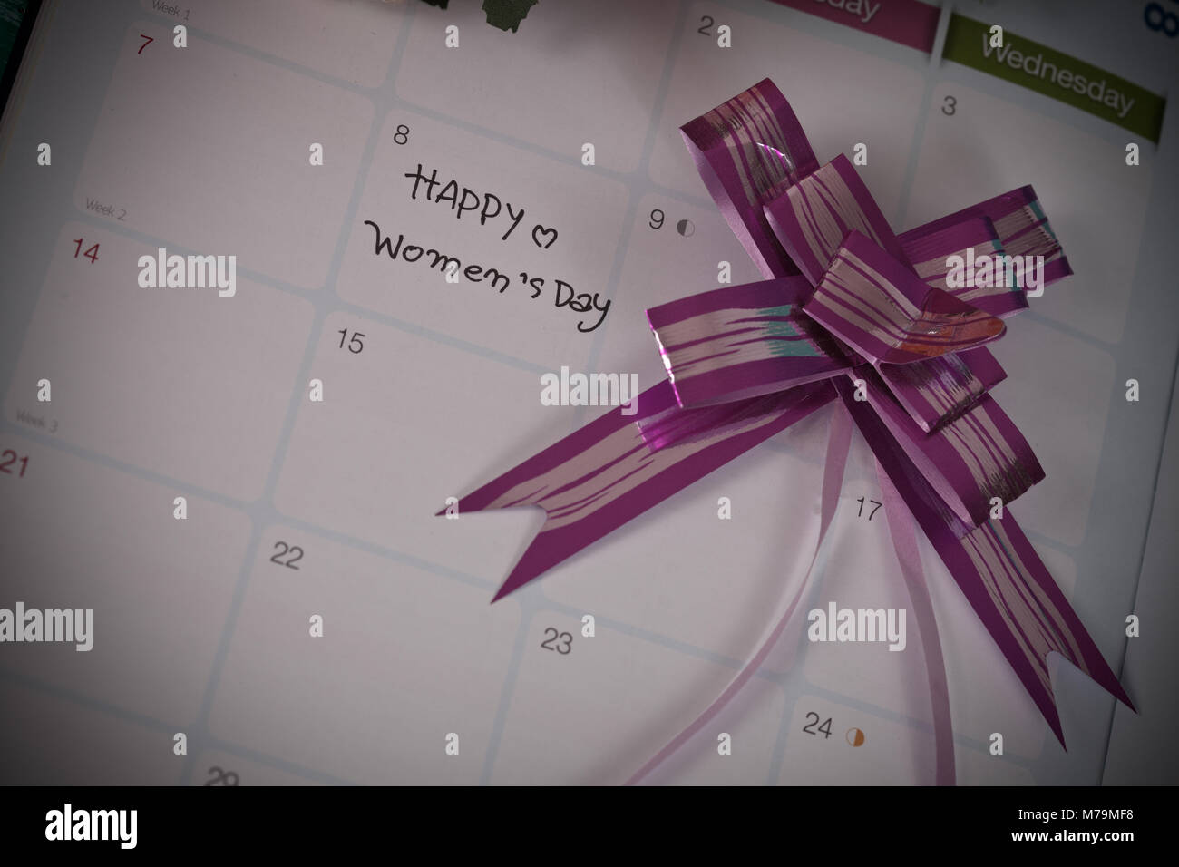Happy women's day note on calendar book Stock Photo - Alamy