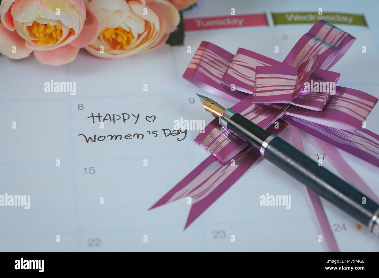Happy women's day note on calendar book Stock Photo - Alamy