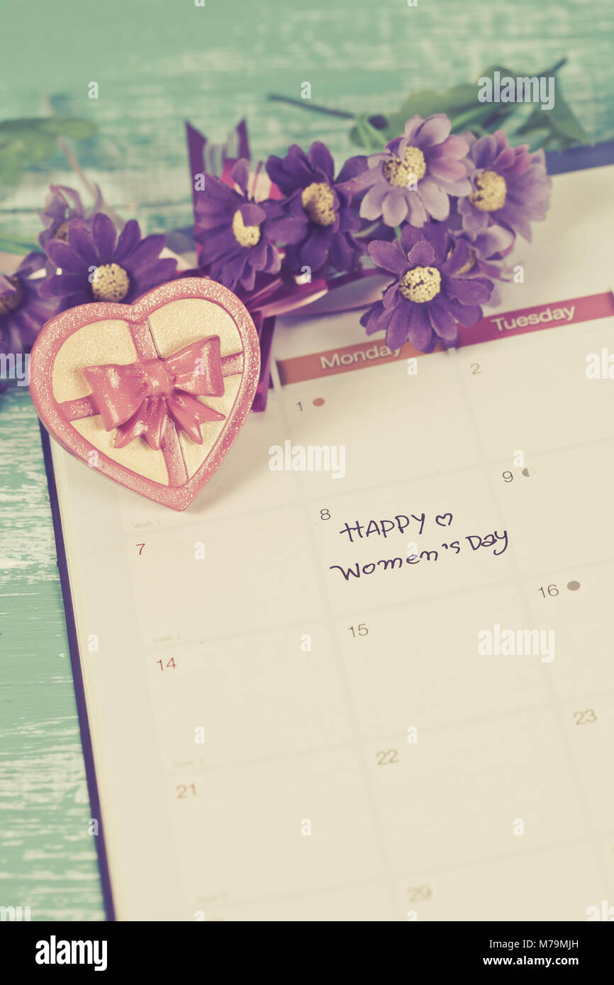Happy women's day note on calendar book Stock Photo - Alamy