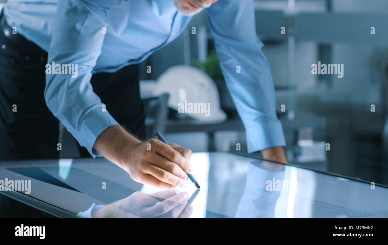 Senior Architectural Engineer Draws Building Concept on a Graphics ...