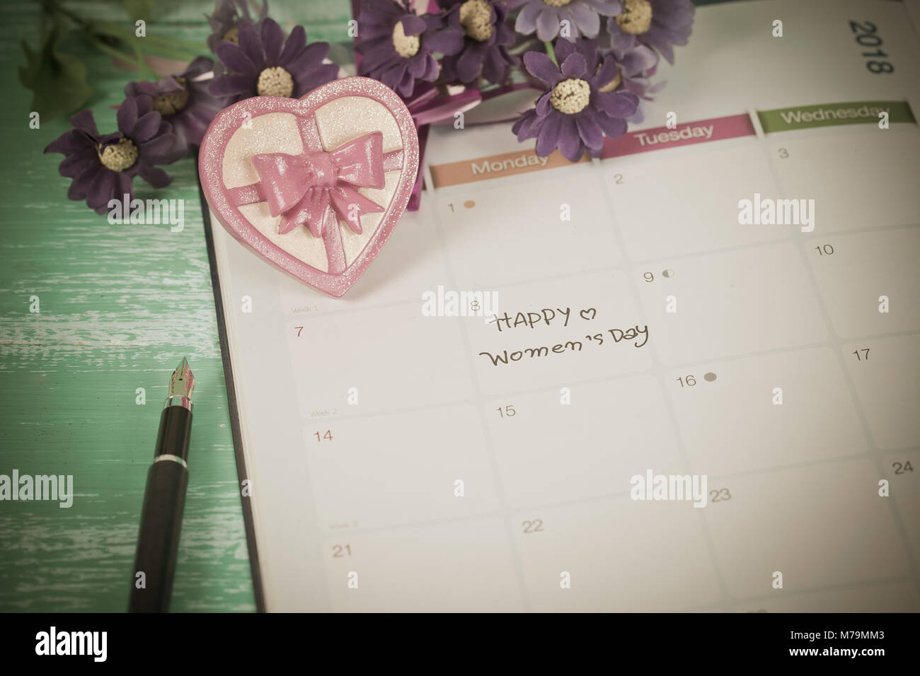 Happy women's day note on calendar book Stock Photo - Alamy