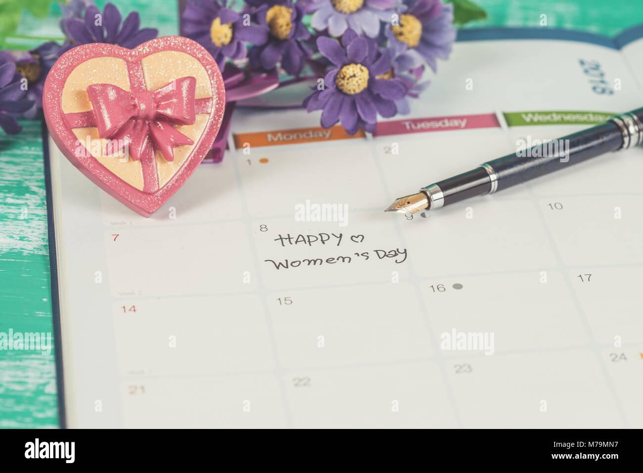 Happy women's day note on calendar book Stock Photo - Alamy
