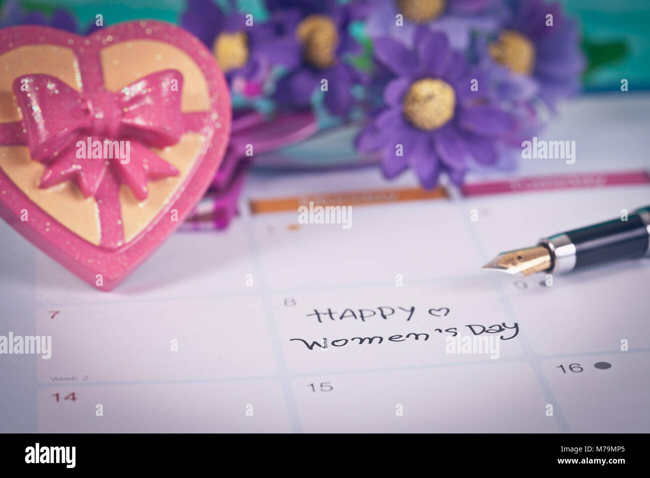 Happy women's day note on calendar book Stock Photo - Alamy