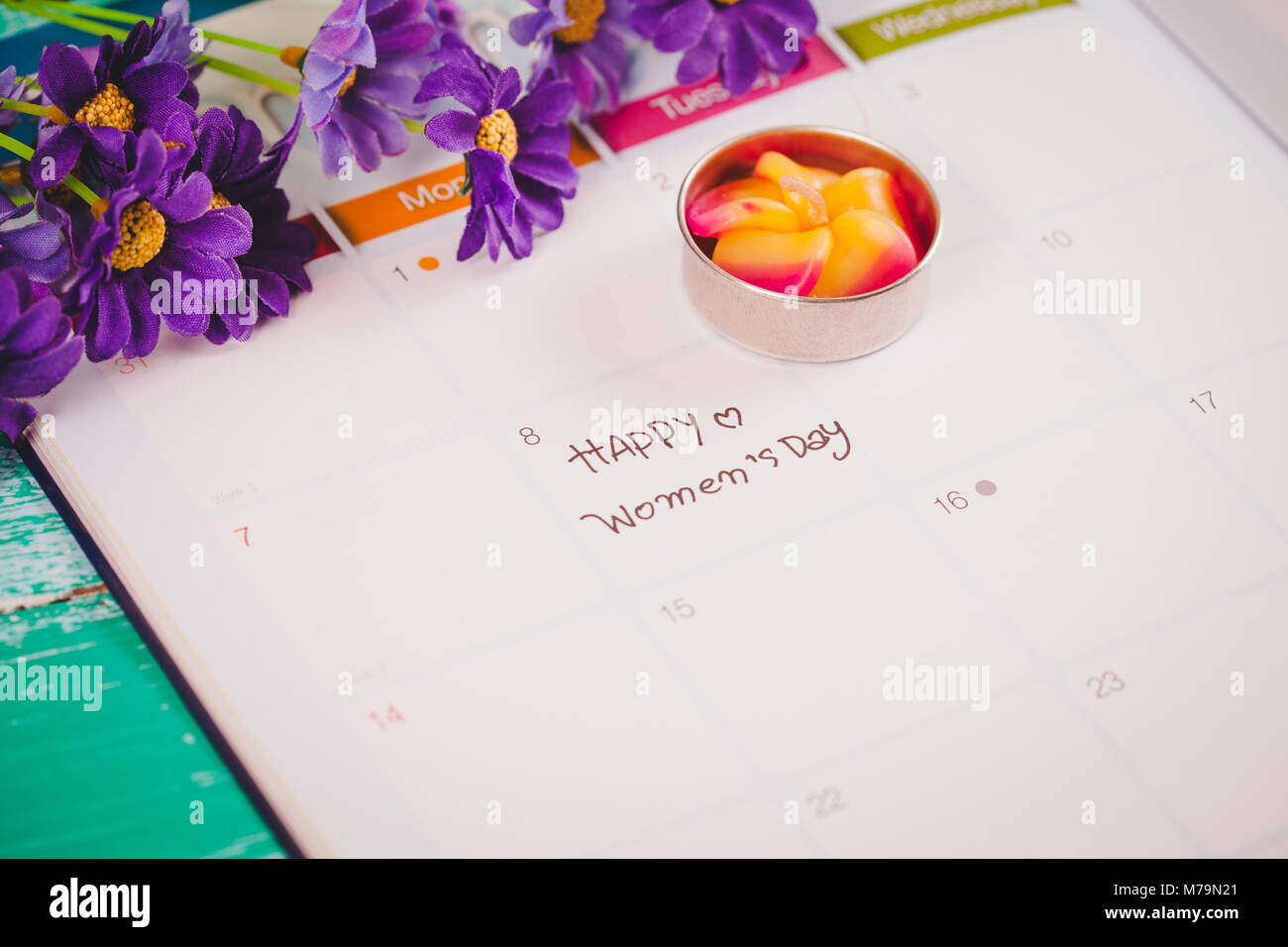 Happy women's day note on calendar book Stock Photo - Alamy