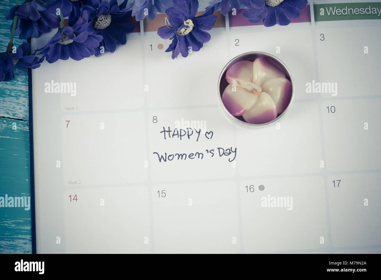 Happy women's day note on calendar book Stock Photo - Alamy