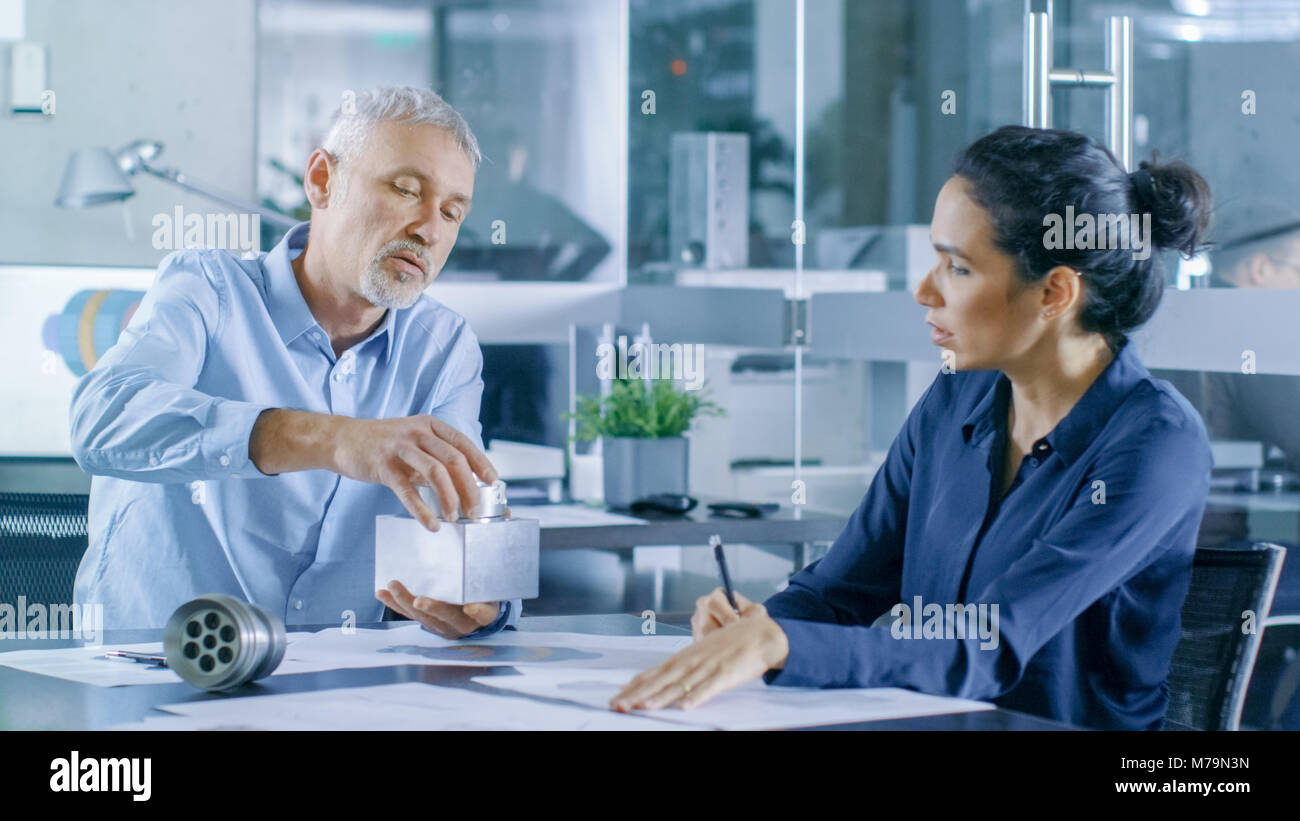 Experienced Male and Female Industrial Engineers have Discussion ...