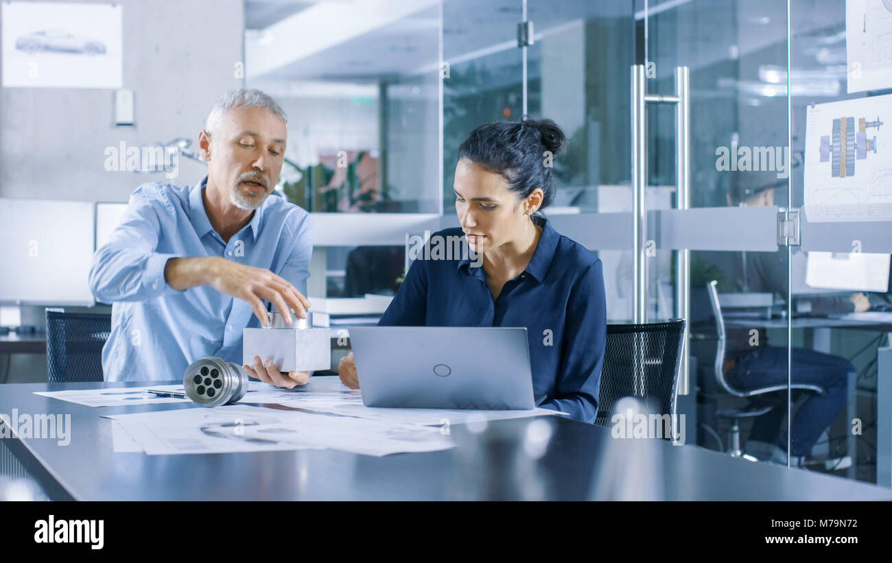 Experienced Male and Female Industrial Engineers have Discussion ...