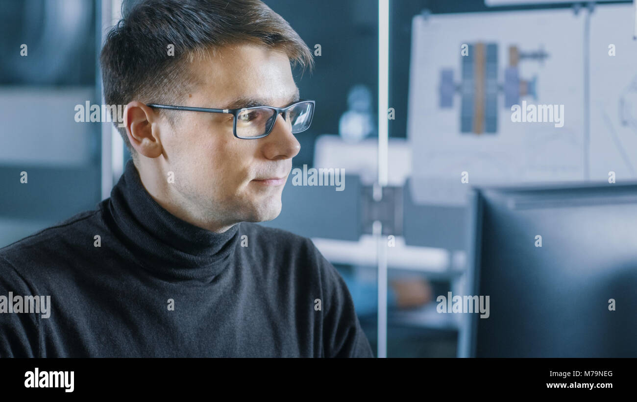 Young Male Industrial Engineer Works on a Personal Computer. Handsome ...