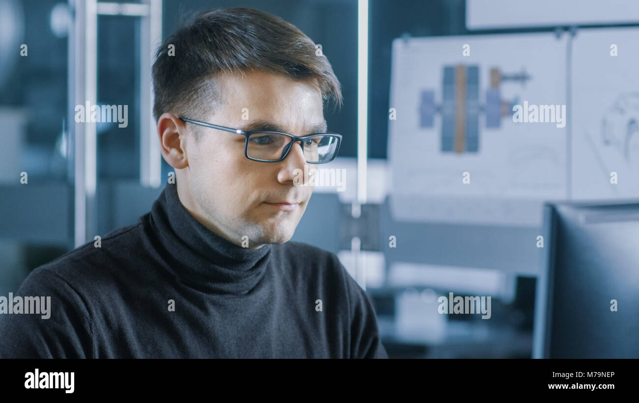 Young Male Industrial Engineer Works on a Personal Computer. Handsome ...