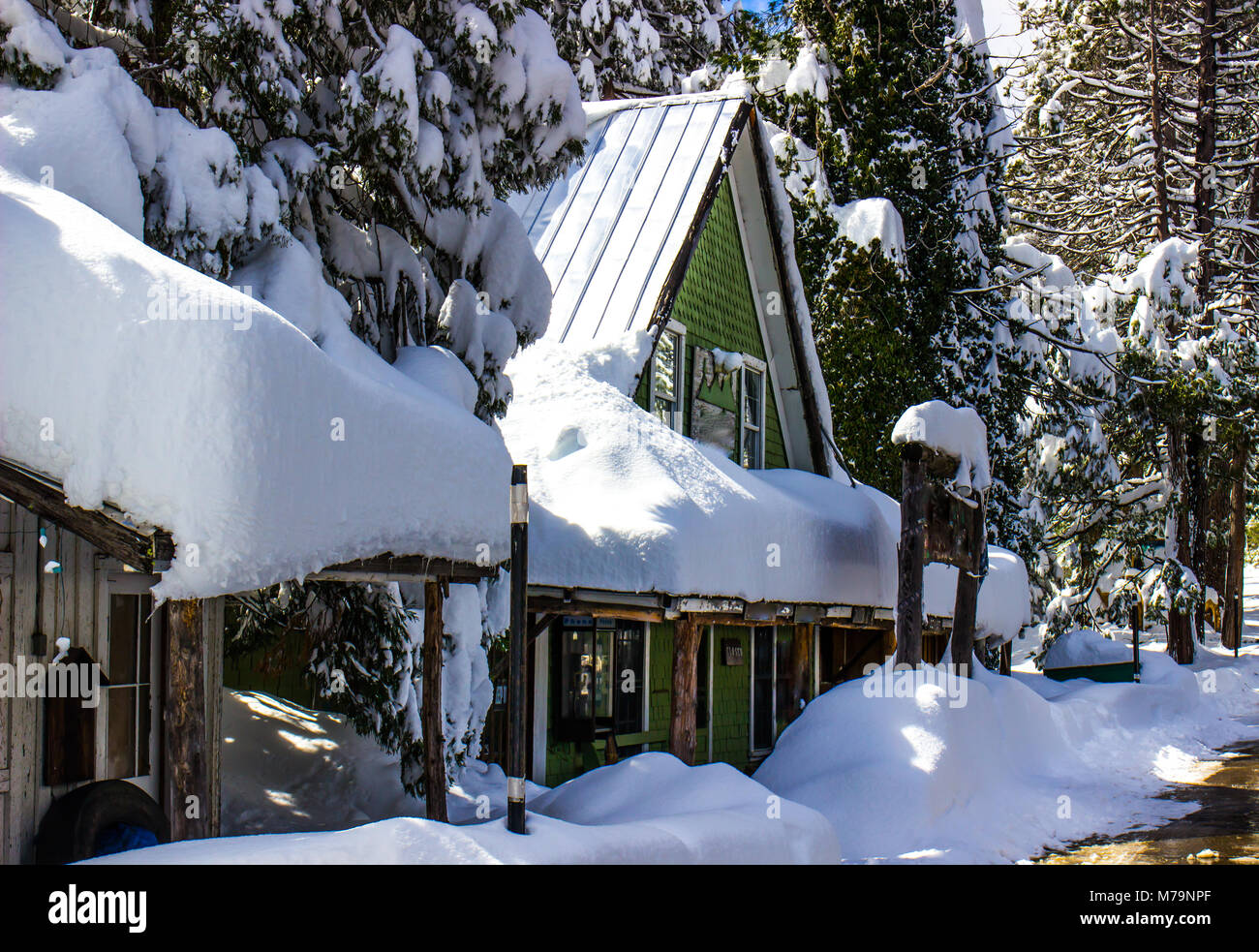 Mountain Building With Snow Heaped On Roof Stock Photo - Alamy