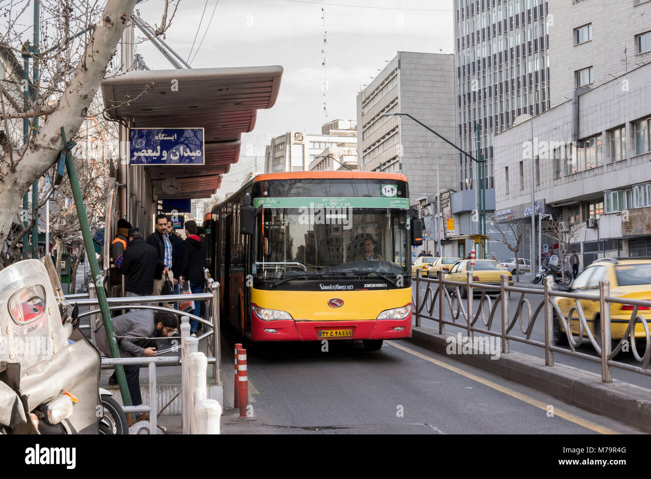 Tehran, IRAN - March 8, 2018 Tehran cityscape, BRT buses driving ...