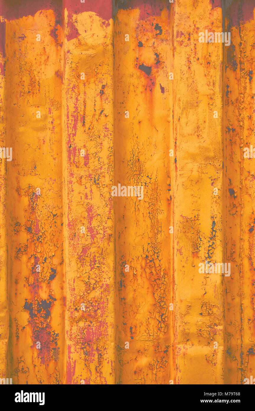 Yellow grunge sea freight container background, dark rusty corrugated ...