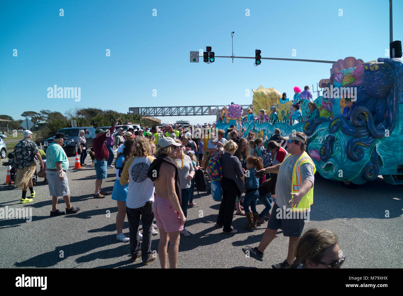 Parade traffic controller marshals people off the road, out of the way ...